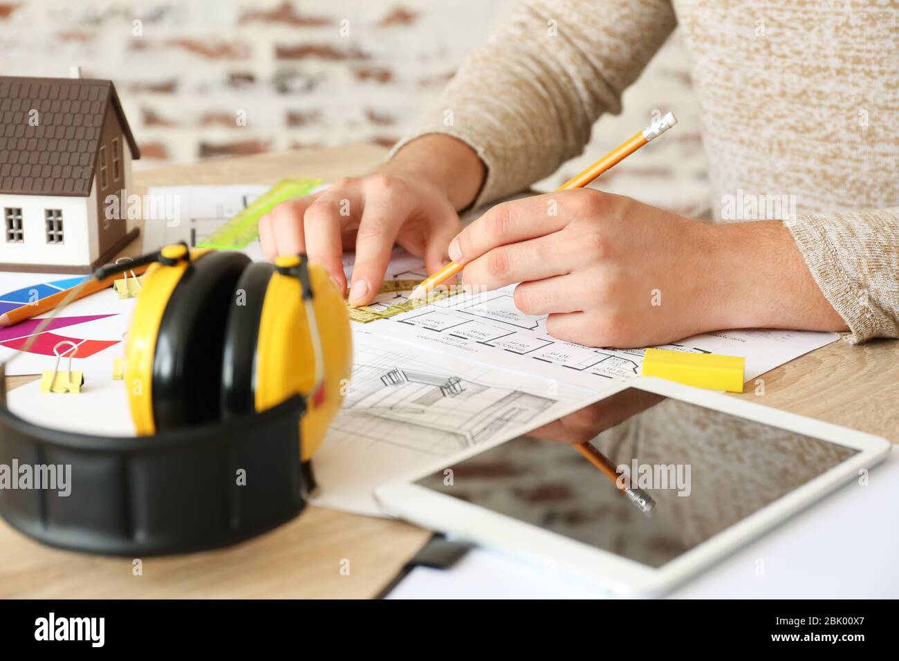 Architect working on project of building in office Stock Photo - Alamy