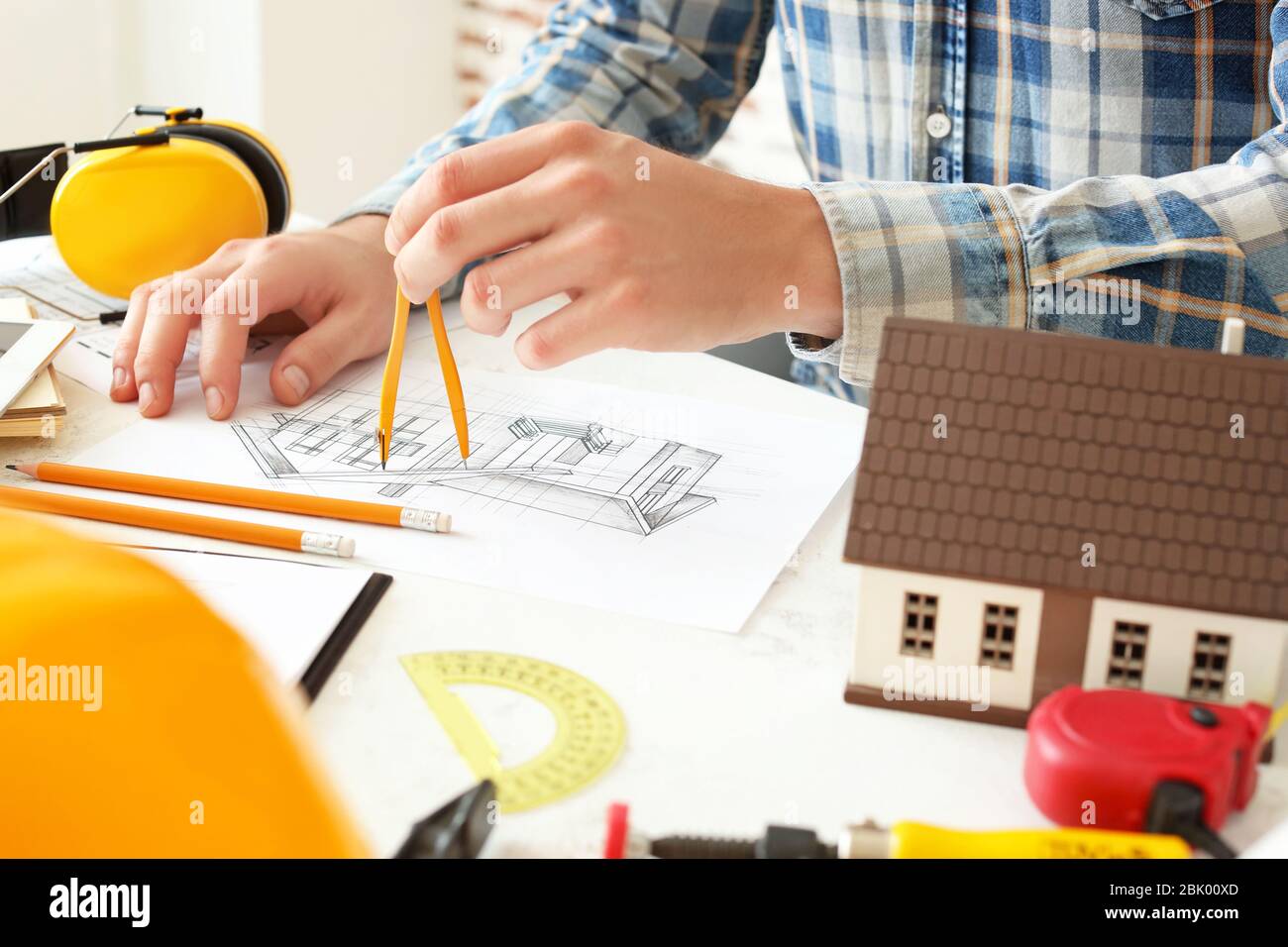 Architect working on project of building in office Stock Photo - Alamy