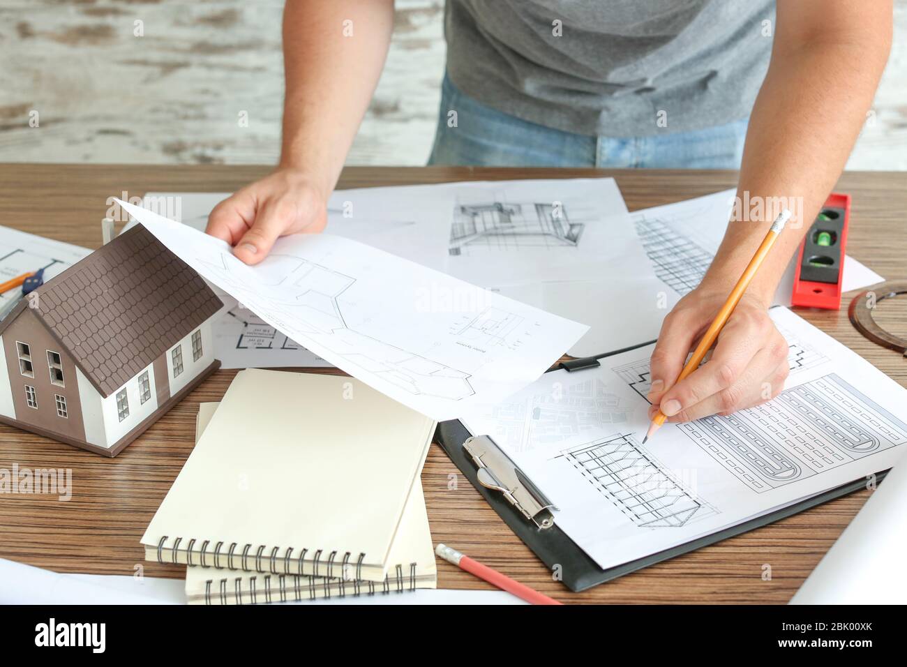 Architect working on project of building in office Stock Photo - Alamy