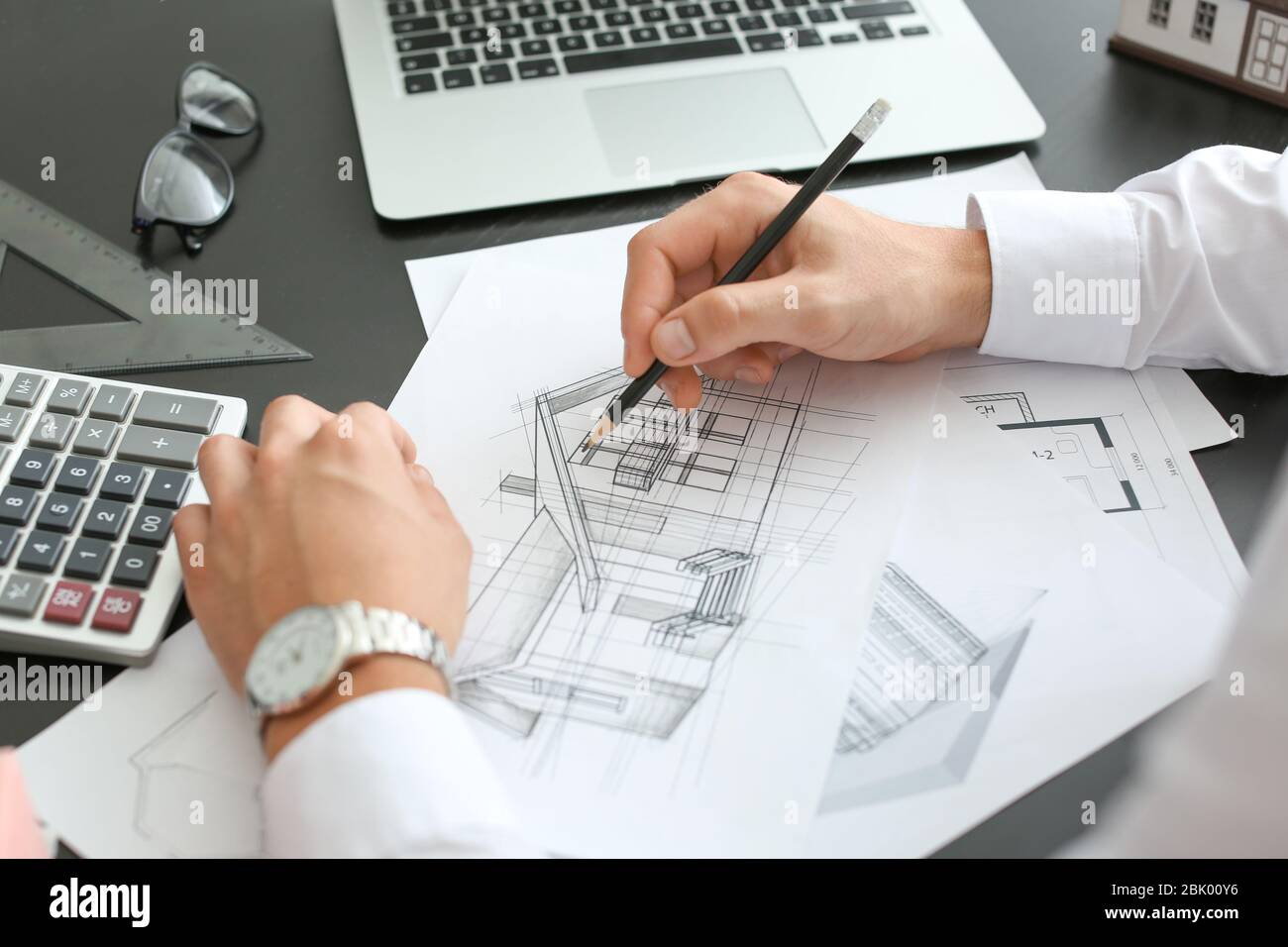 Architect working on project of building in office Stock Photo - Alamy