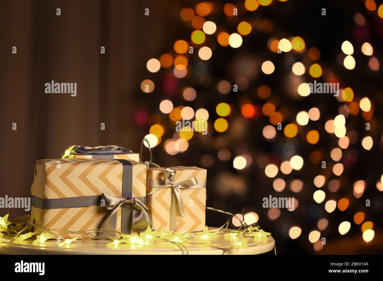 Beautiful gift boxes on table in room Stock Photo - Alamy