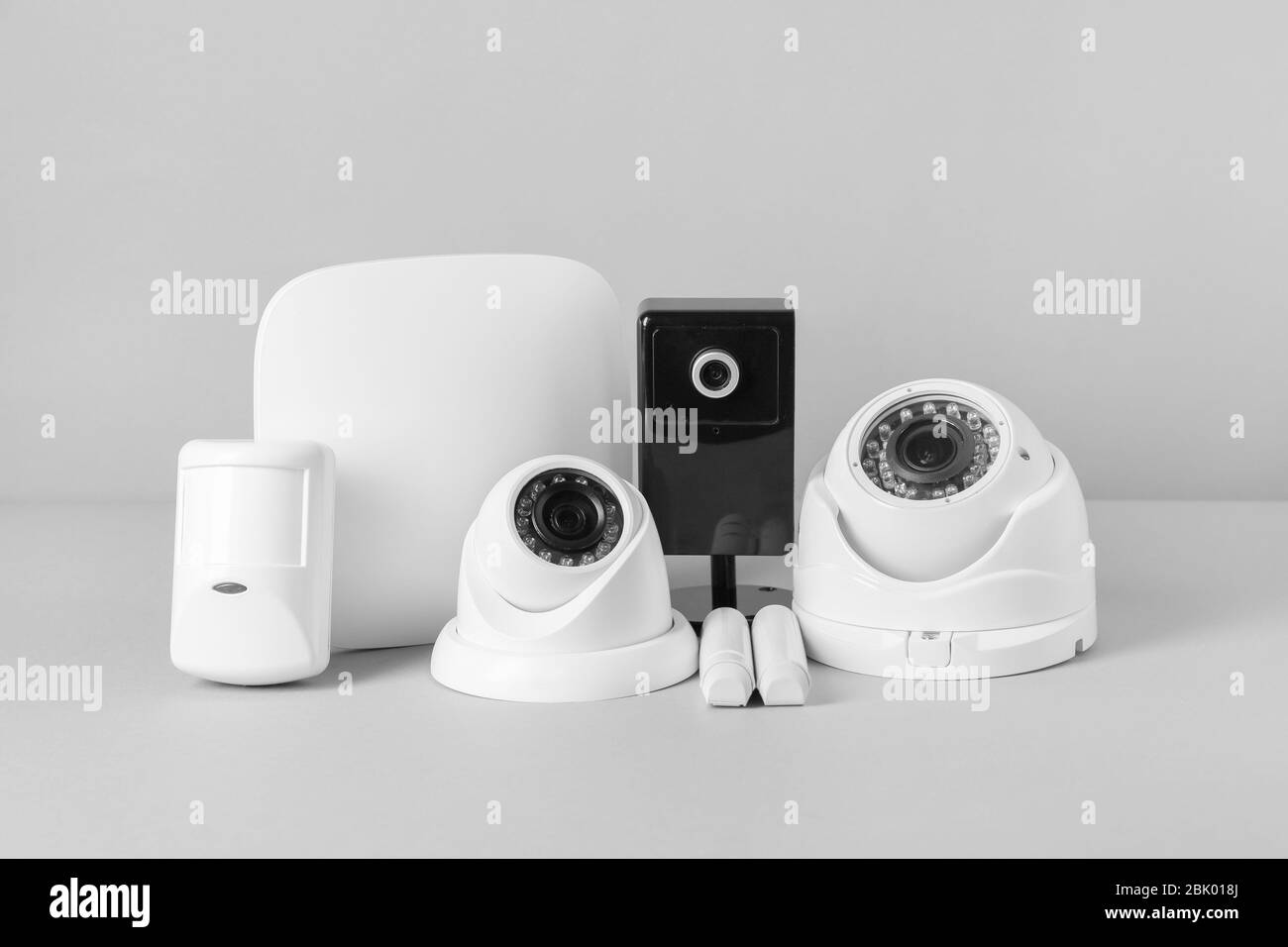 Different equipment of security system on grey background Stock Photo ...