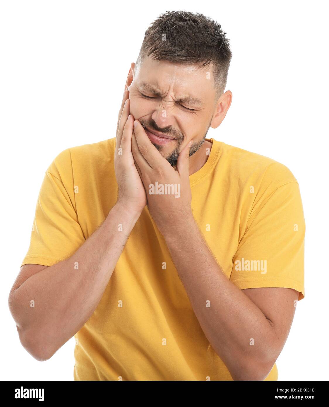 Man suffering from toothache against white background Stock Photo - Alamy