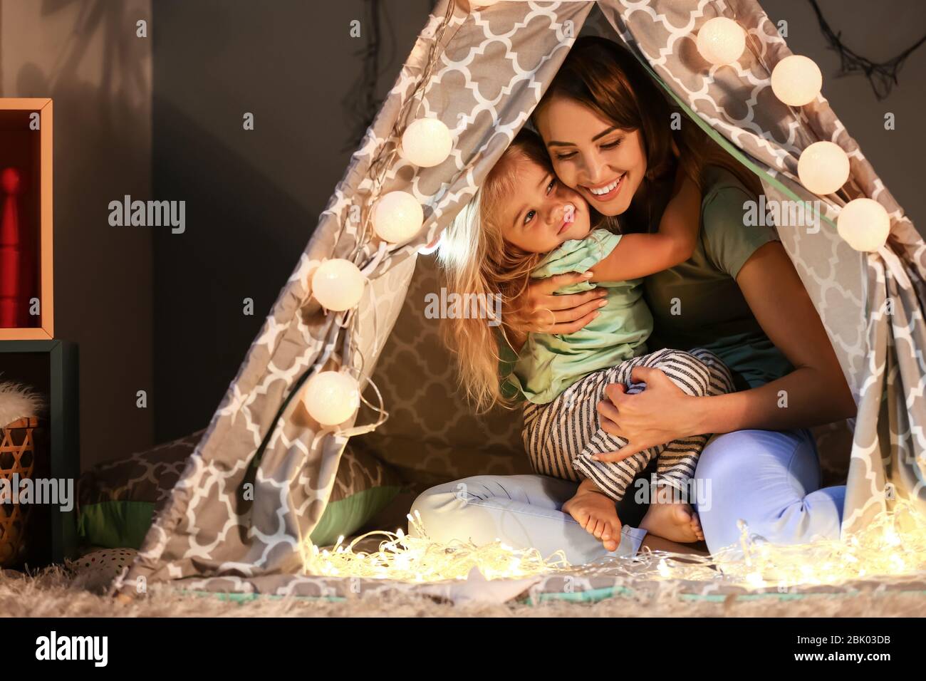 Happy mother and her little daughter in hovel at home Stock Photo - Alamy