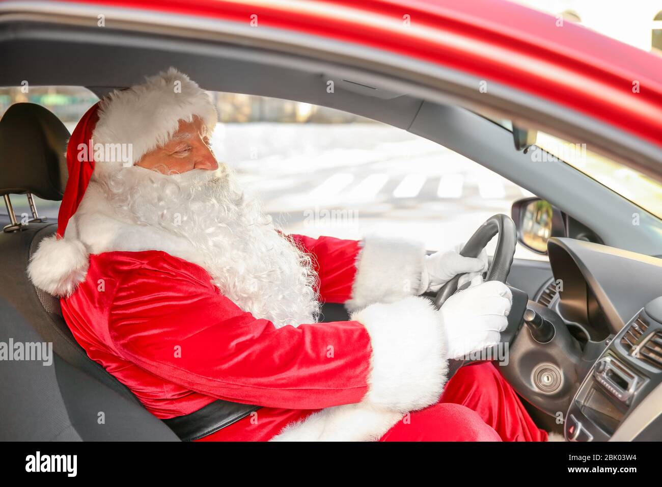 Santa Claus driving modern car Stock Photo - Alamy