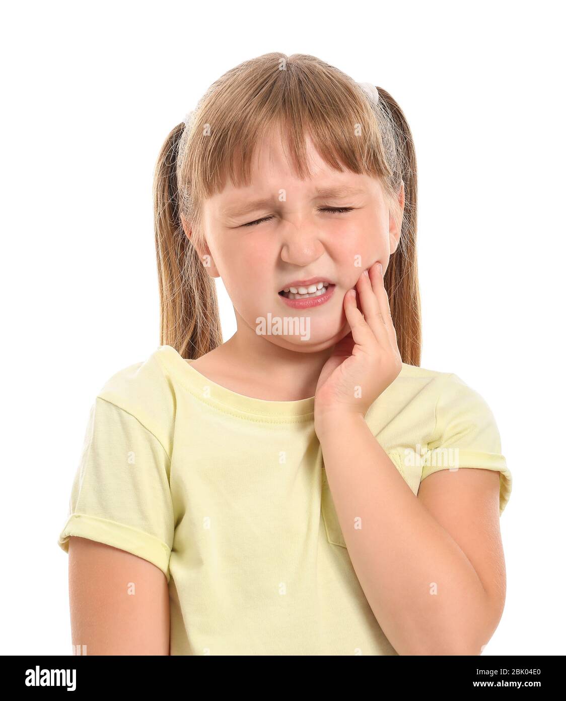 Little girl suffering from toothache on white background Stock Photo ...