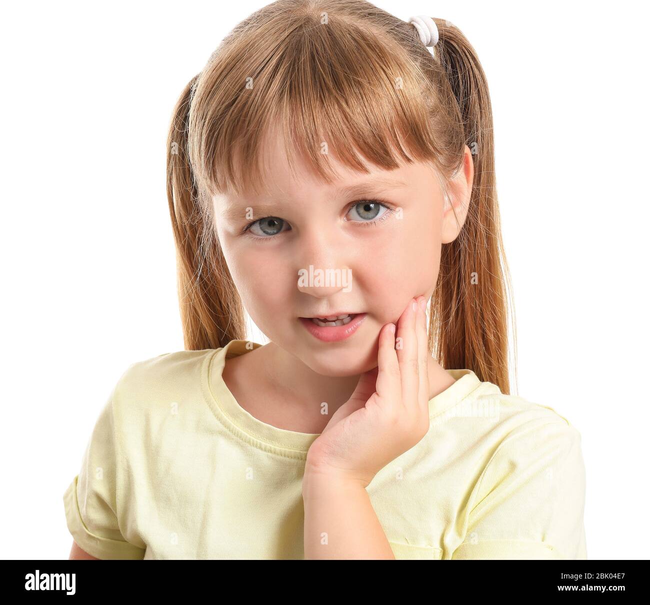 Little girl suffering from toothache on white background Stock Photo ...