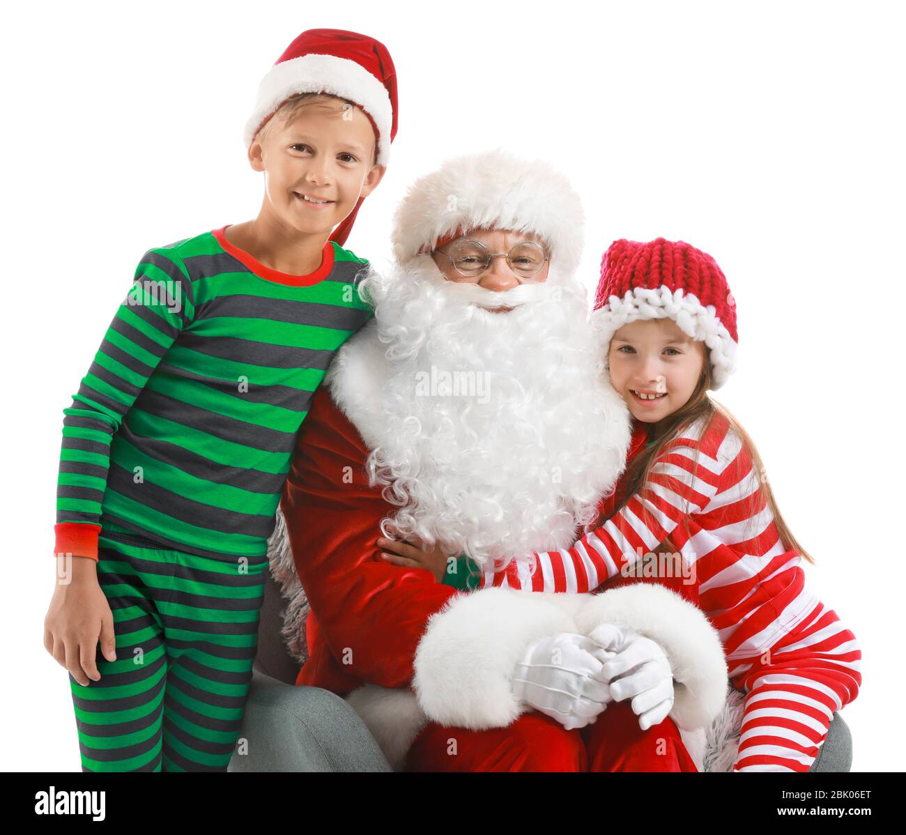 Santa Claus and little elf kids against white background Stock Photo ...