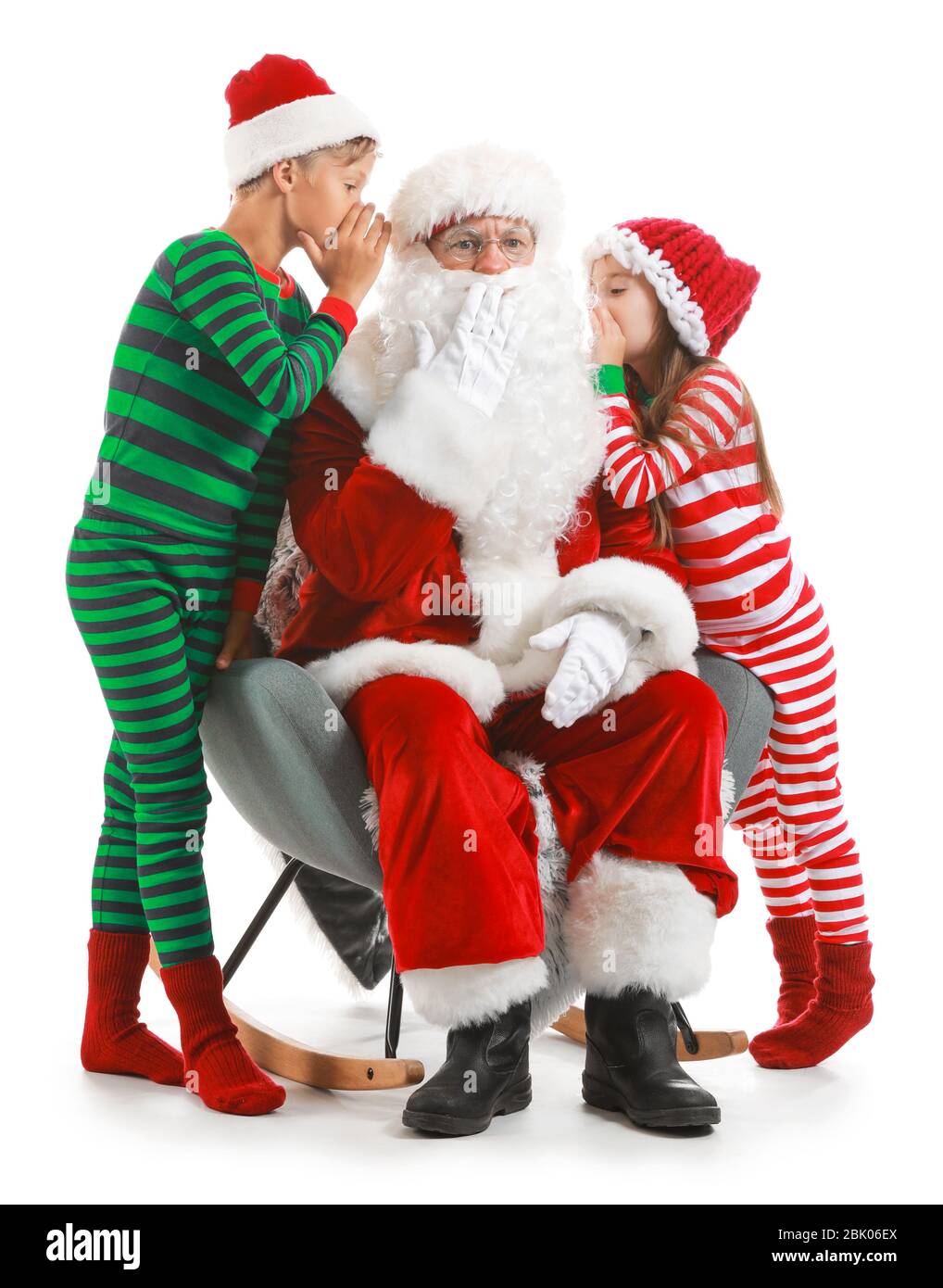Little children telling Santa their wishes against white background ...