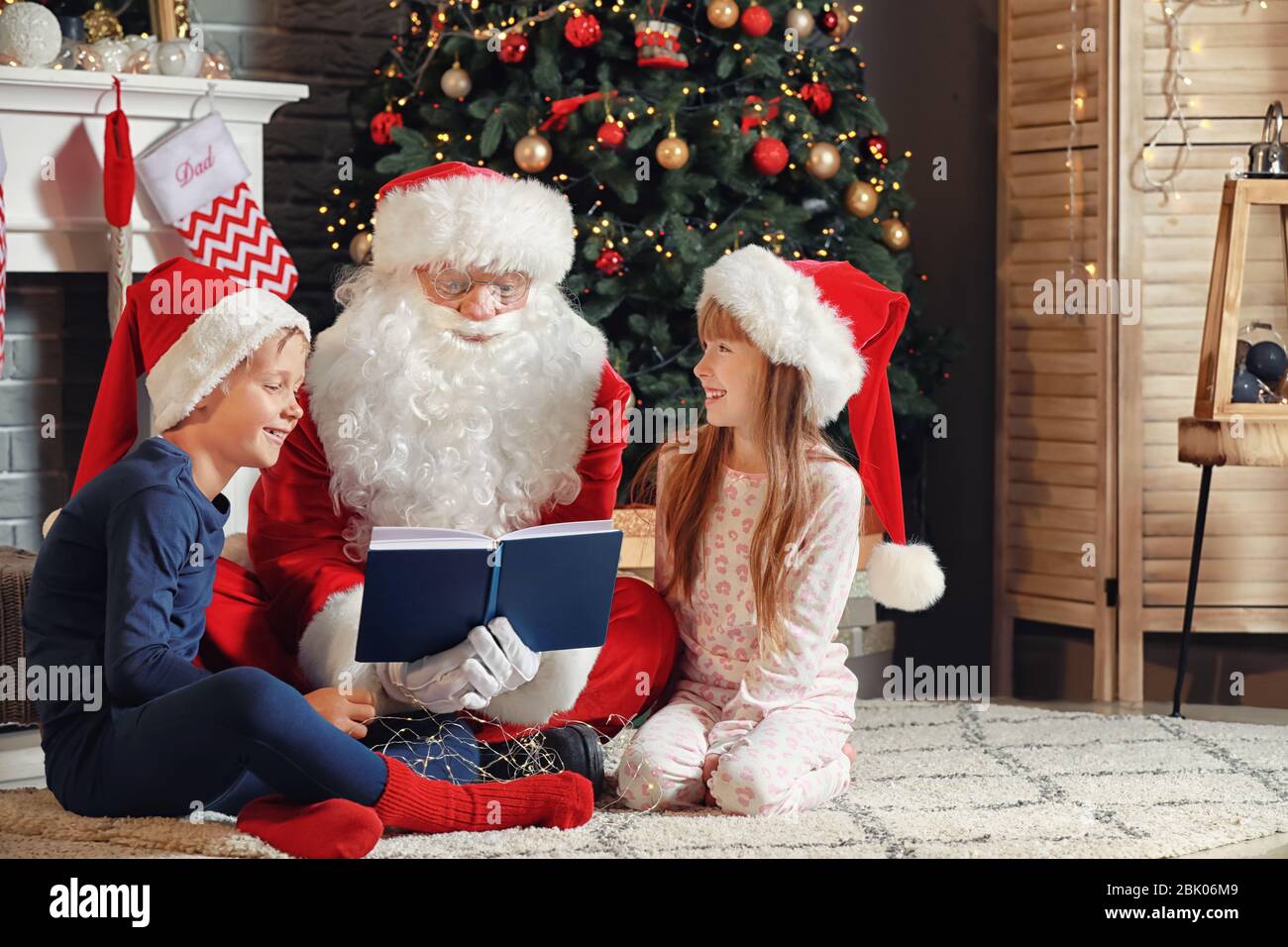 Santa Reading A Book To Children