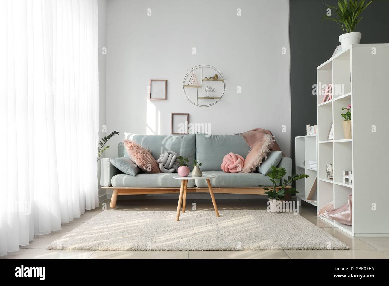Interior of beautiful modern room with comfortable sofa Stock Photo - Alamy