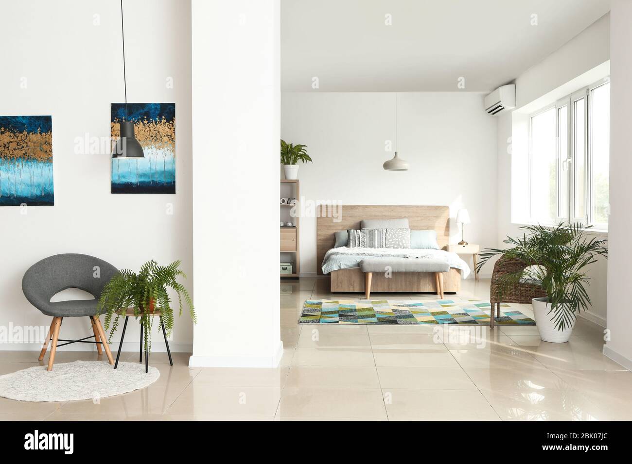 Interior of light modern studio apartment Stock Photo - Alamy