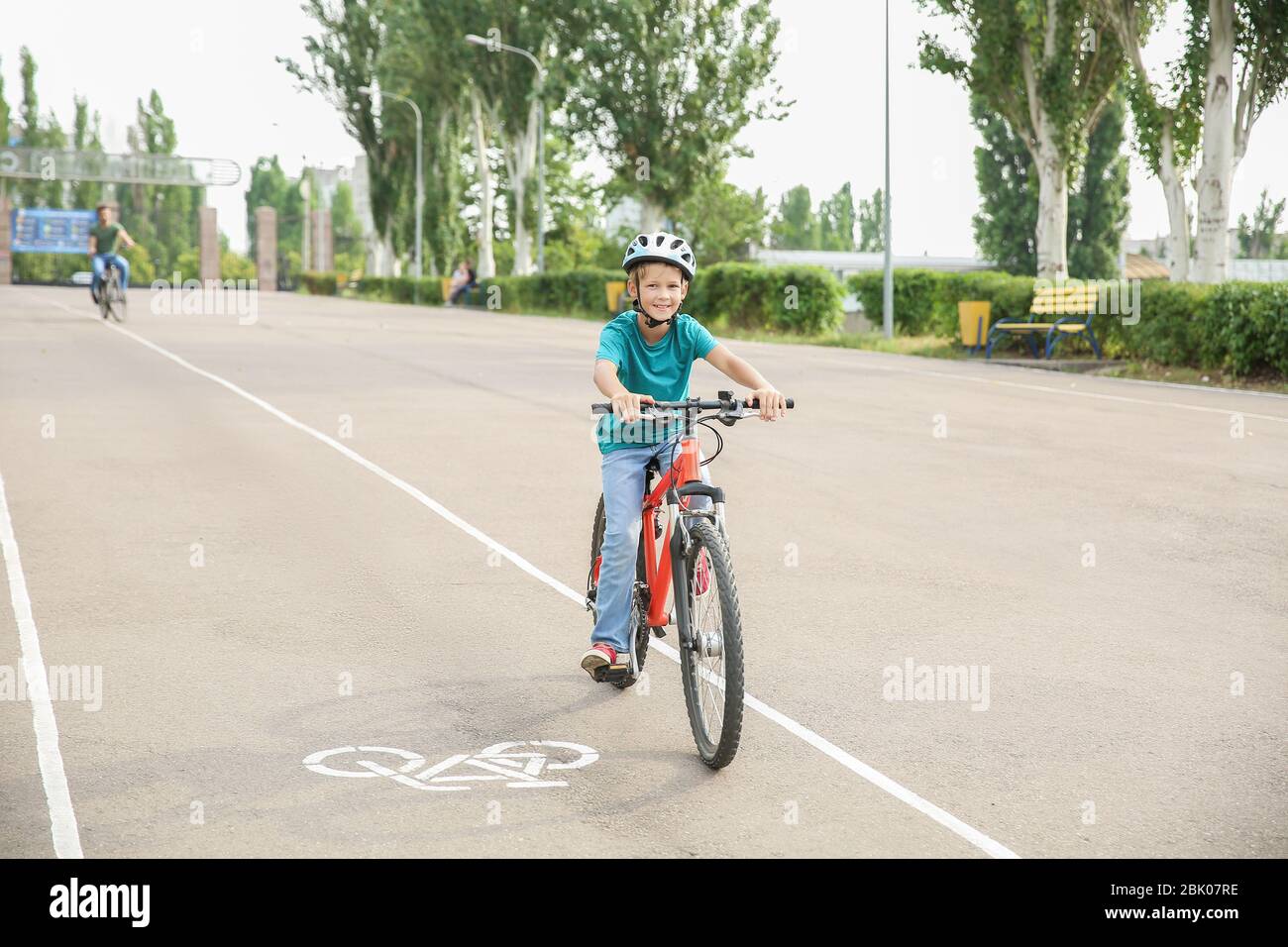 Cute little boy riding bicycle outdoors Stock Photo - Alamy