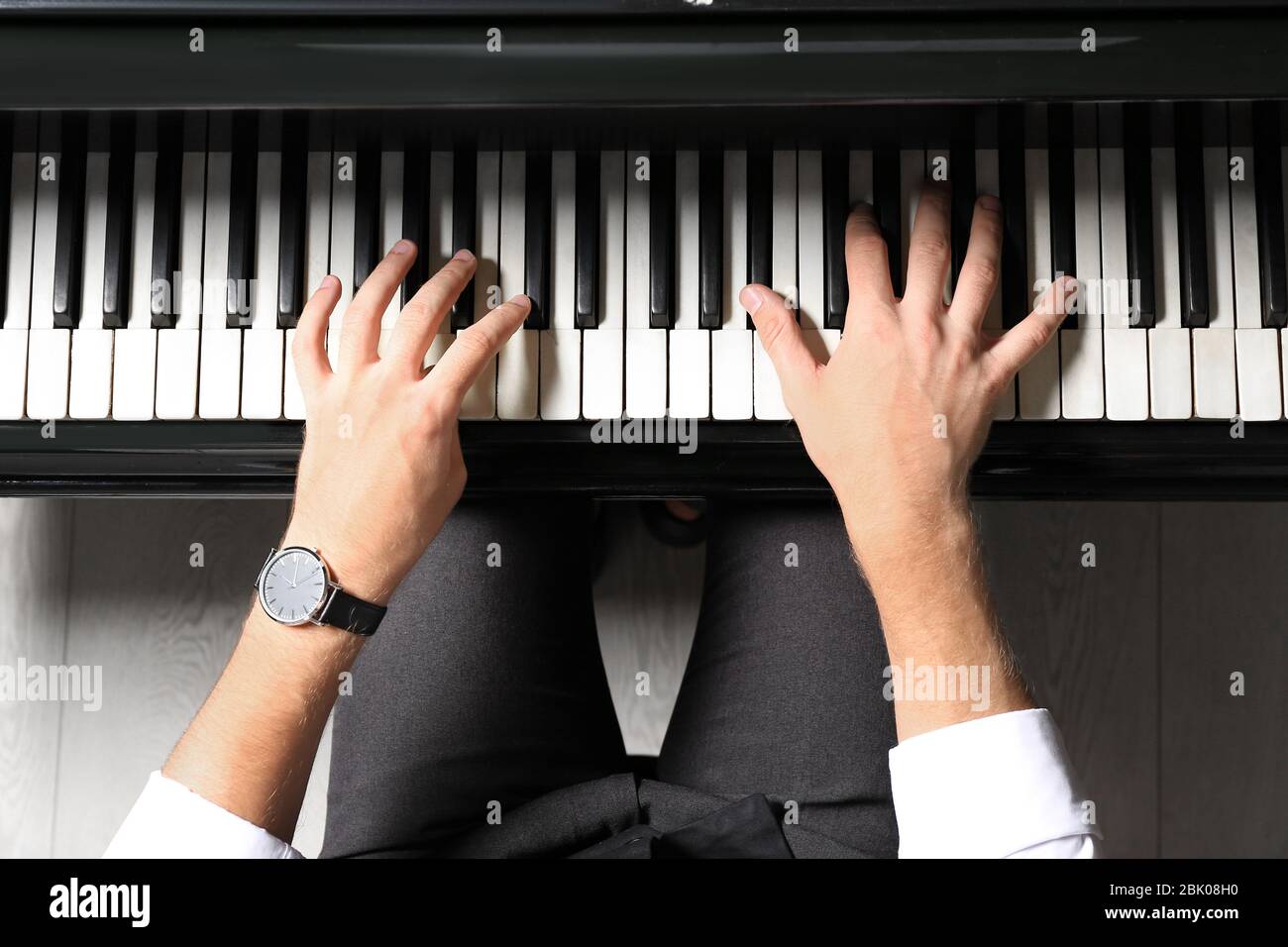 Man playing grand piano at the concert, top view Stock Photo - Alamy