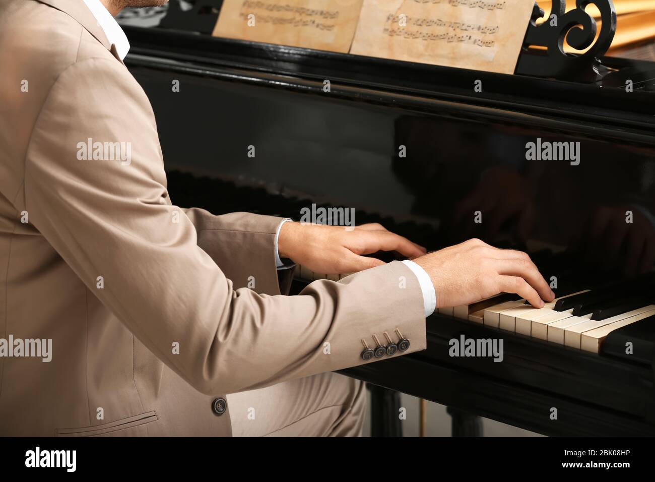 Man playing grand piano hi-res stock photography and images - Alamy
