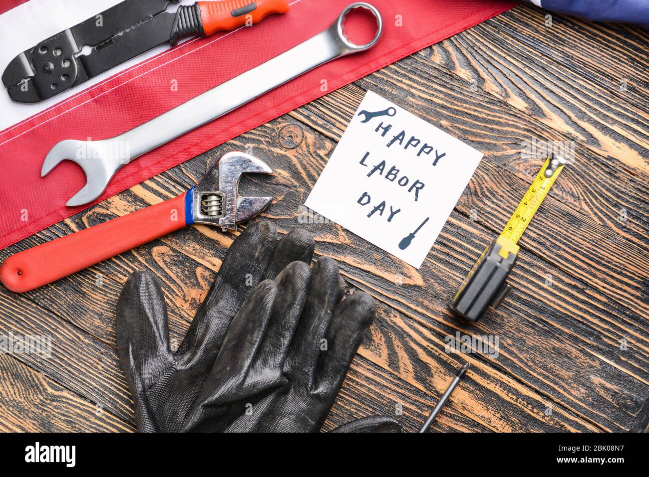 Set of tools, card with text LABOR DAY and USA flag on wooden ...