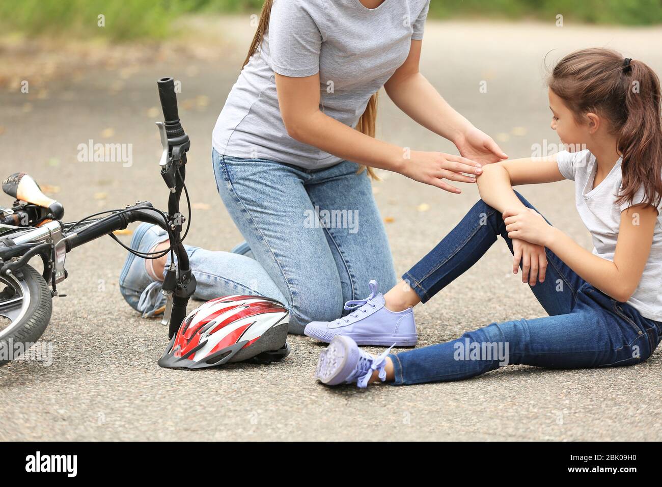 Child falling off bike hi-res stock photography and images - Alamy