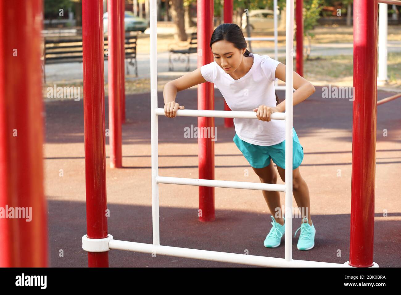 Sporty Asian woman training outdoors Stock Photo - Alamy
