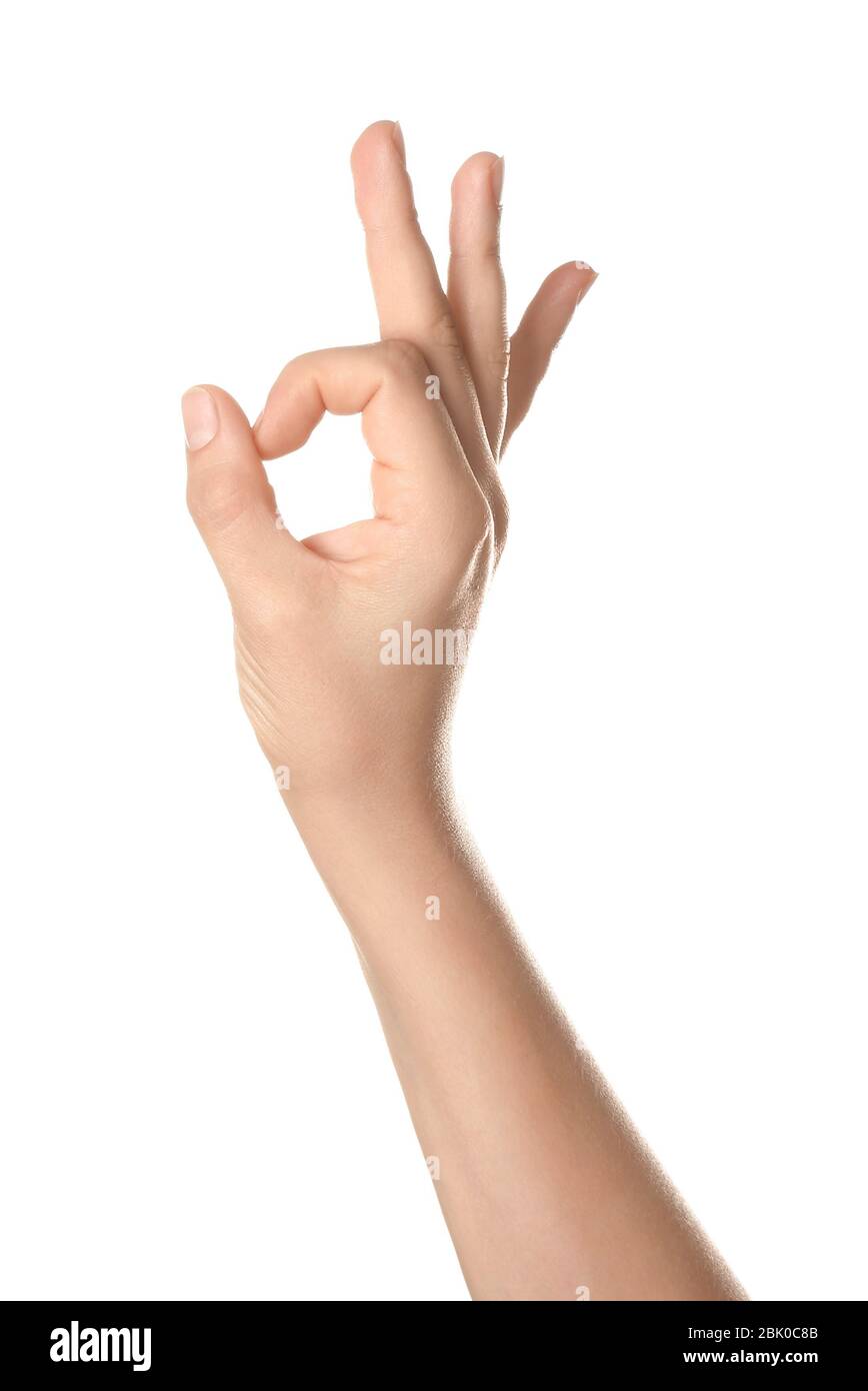 Female hand showing OK gesture on white background Stock Photo - Alamy