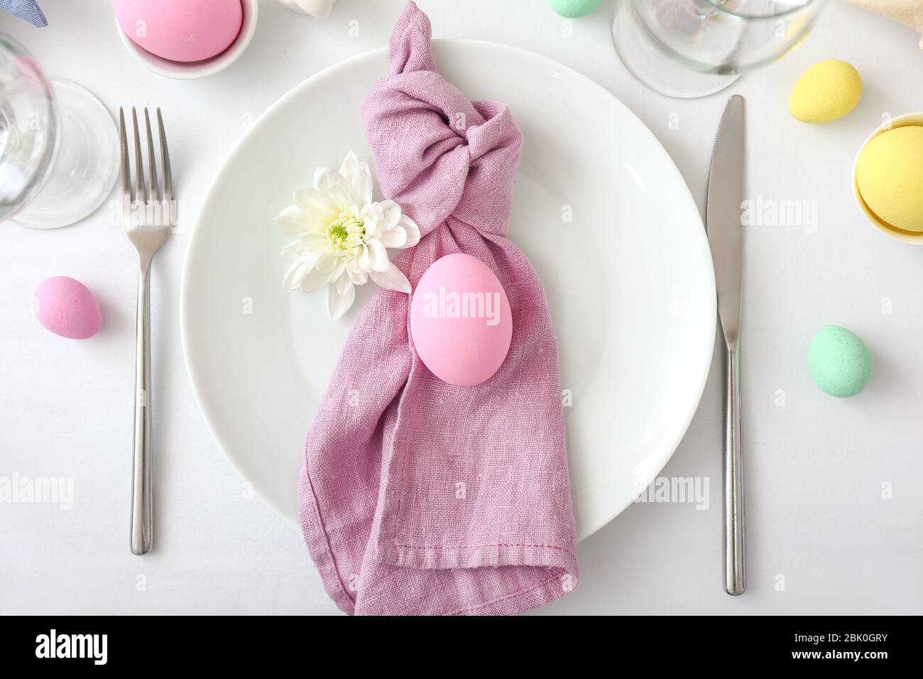 Table setting for Easter celebration on white background Stock Photo ...