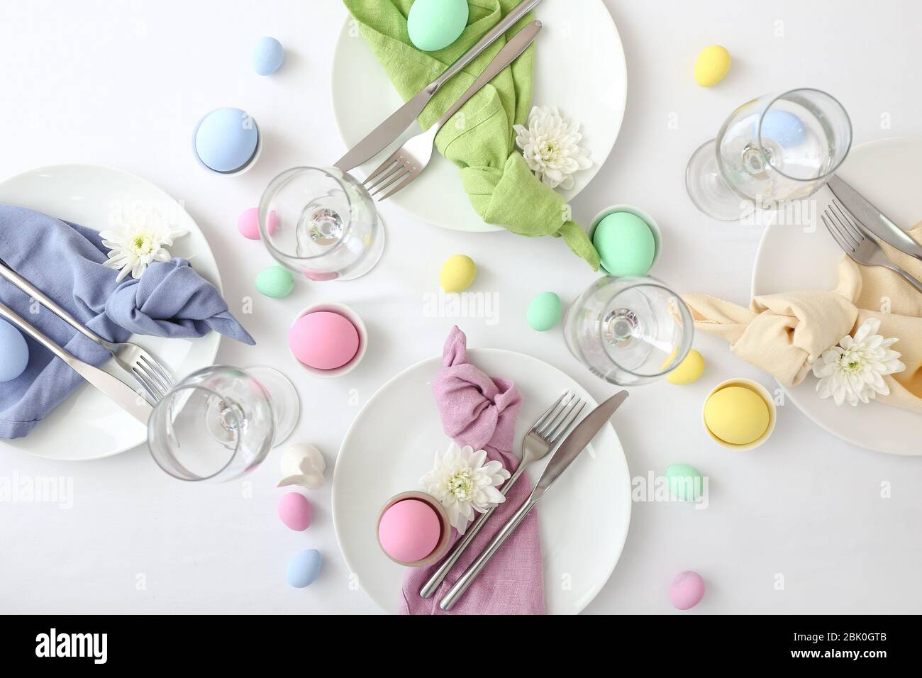 Table setting for Easter celebration on white background Stock Photo ...