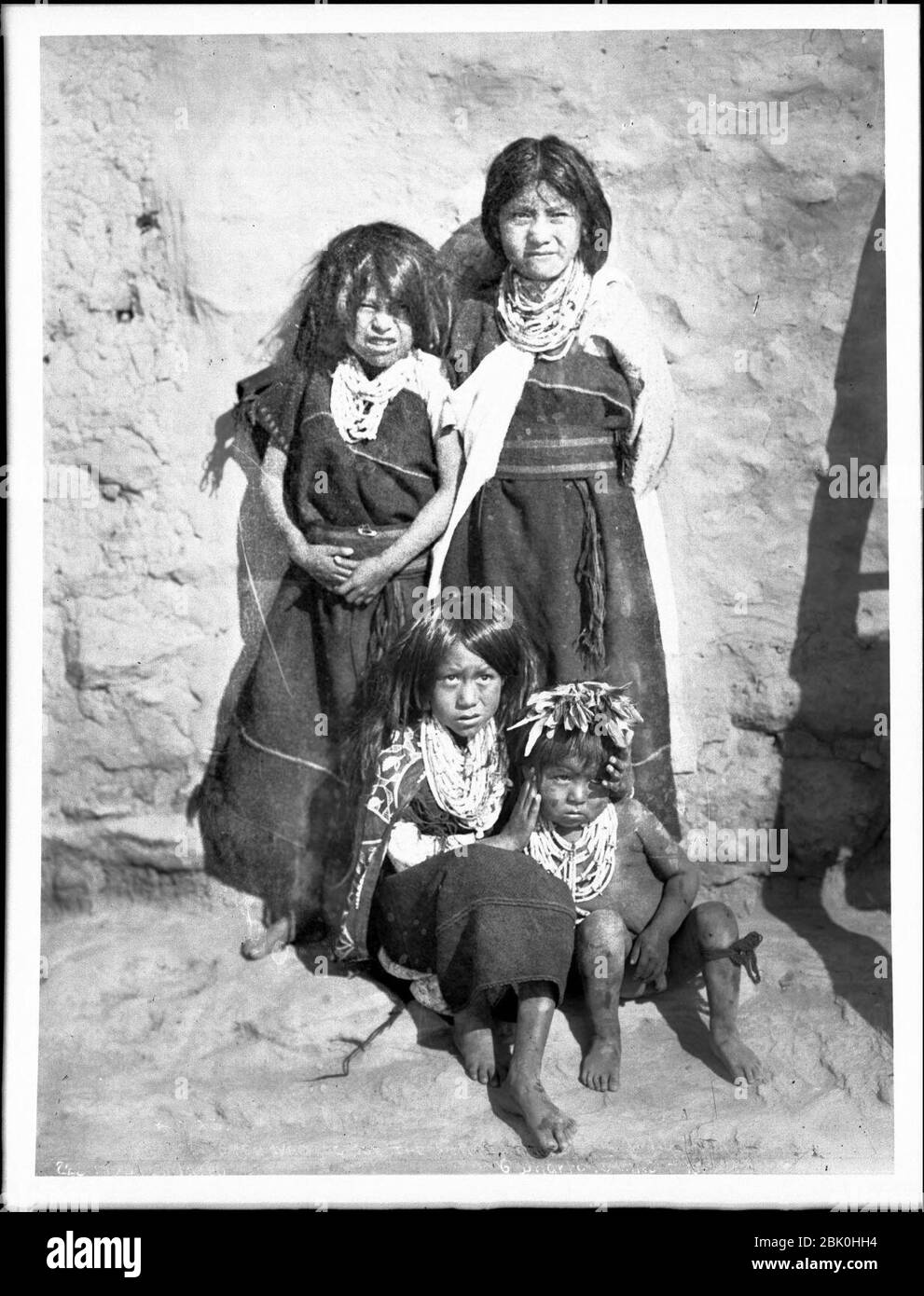 Hopi children from a well-to-do family waiting for the Snake Dance at the pueblo of Walpi ...