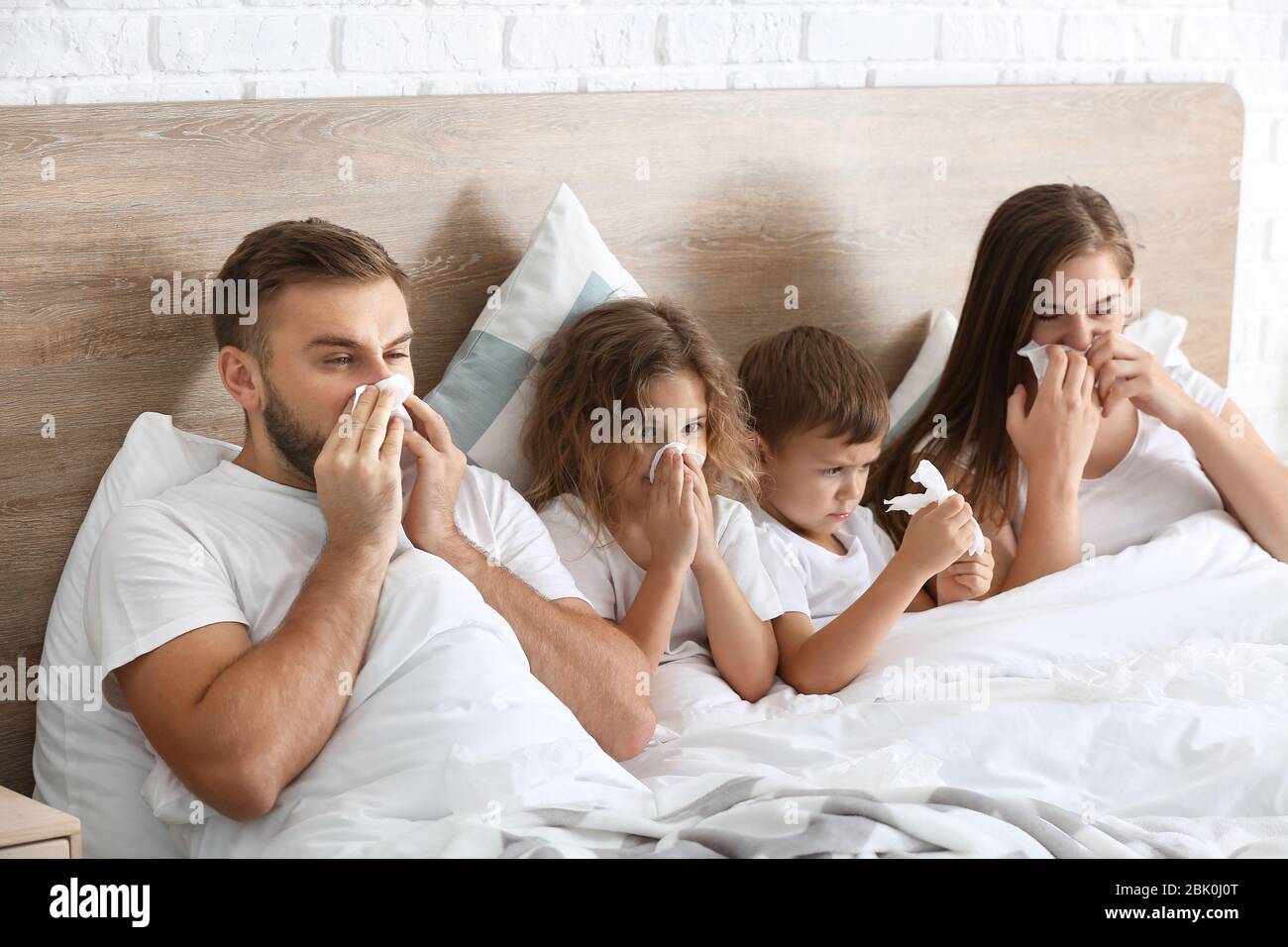 Family ill with flu in bed at home Stock Photo - Alamy