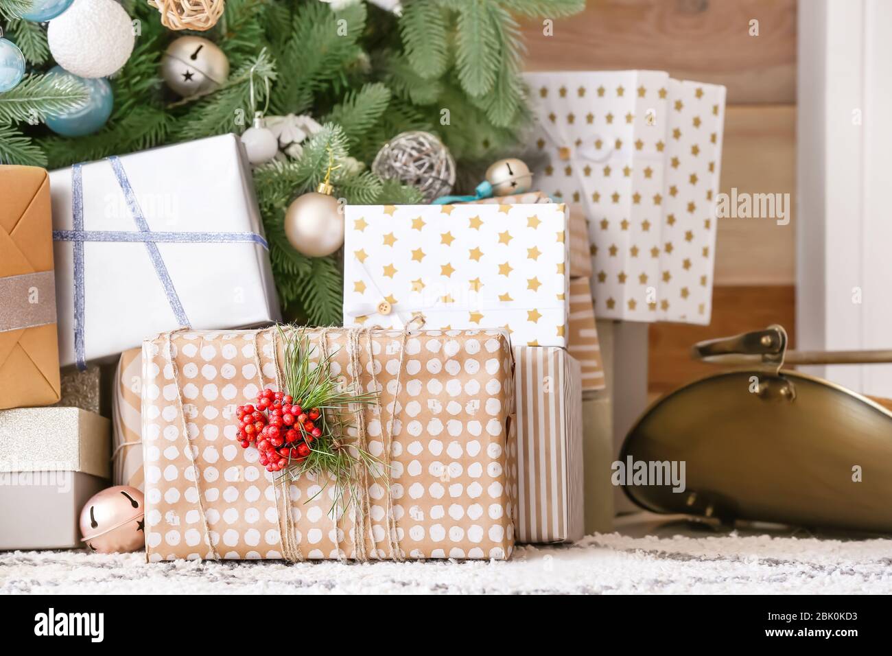 Many beautiful gift boxes under Christmas tree Stock Photo - Alamy