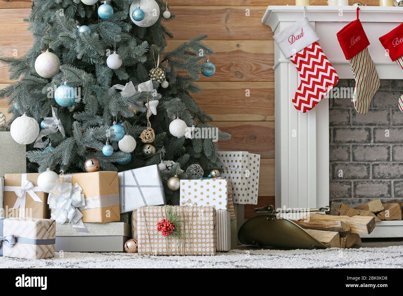Many beautiful gift boxes under Christmas tree Stock Photo - Alamy