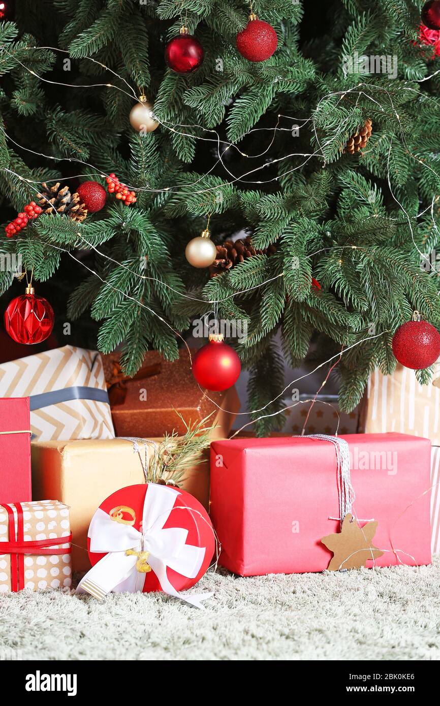 Many beautiful gift boxes under Christmas tree Stock Photo - Alamy