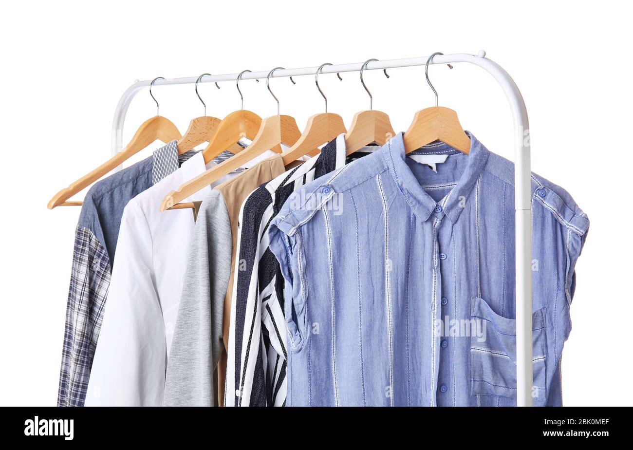 Rack with hanging clothes on white background Stock Photo - Alamy