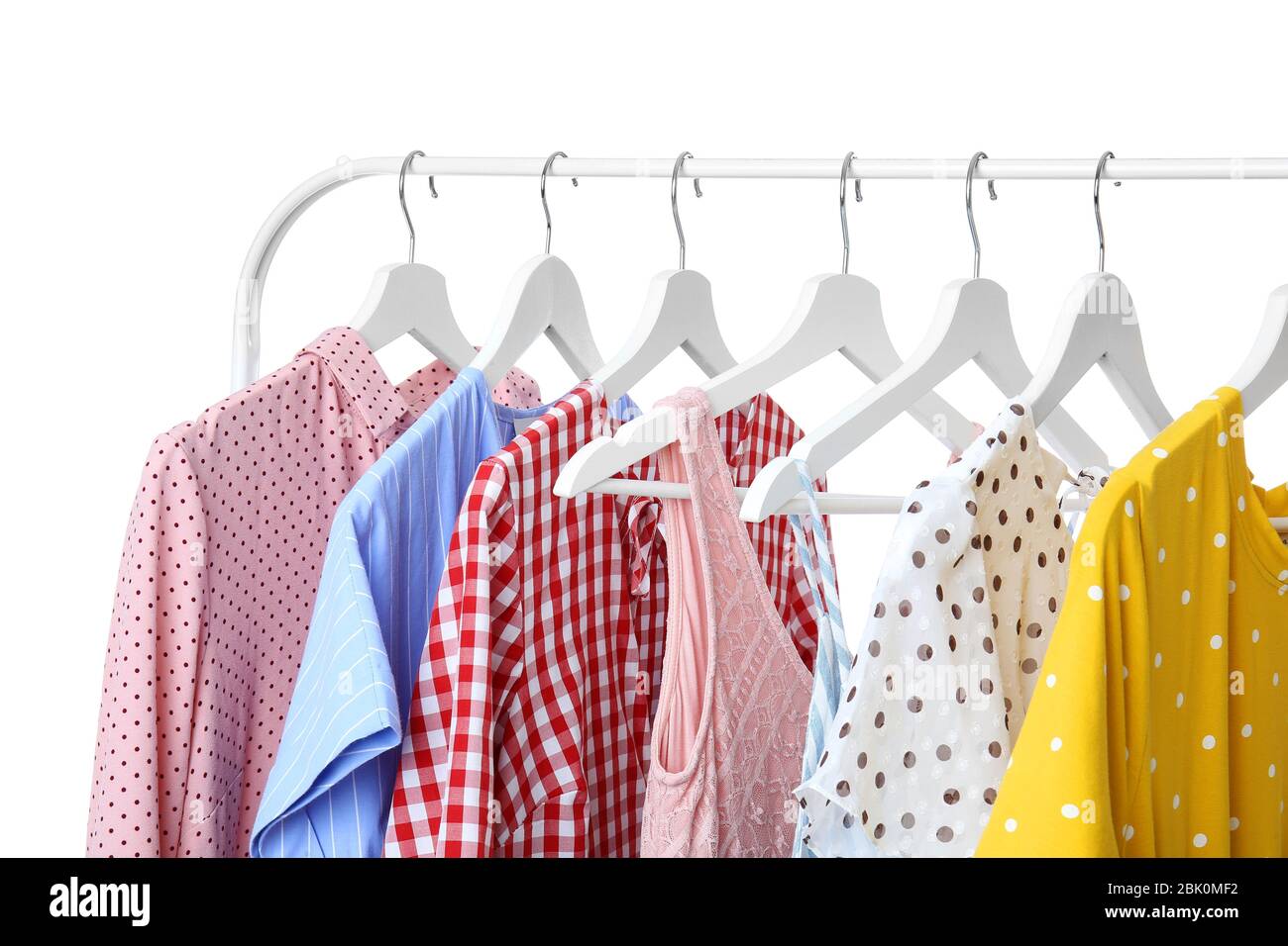Rack with hanging clothes on white background Stock Photo - Alamy