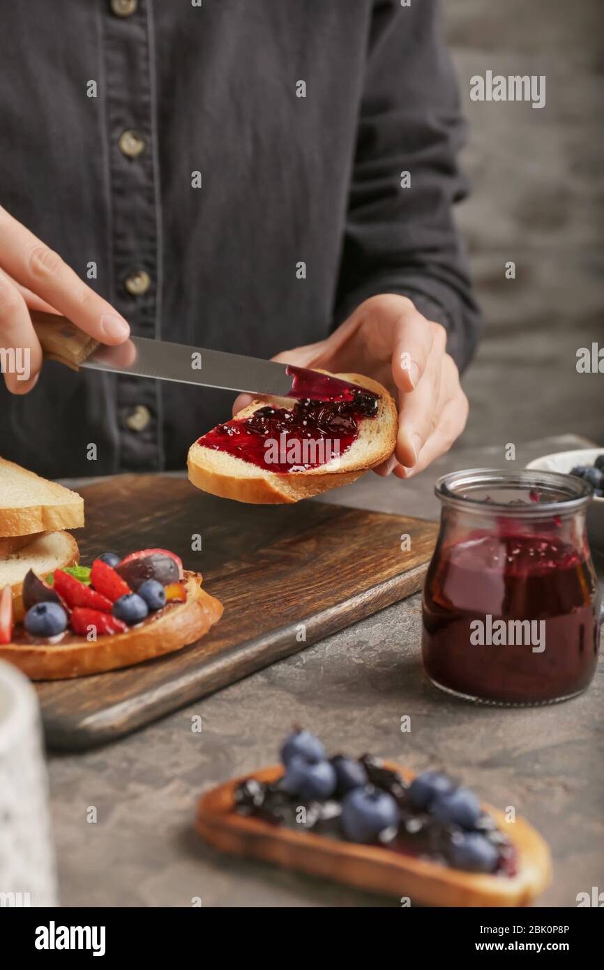 Hands female spreading jam toast hi-res stock photography and images ...