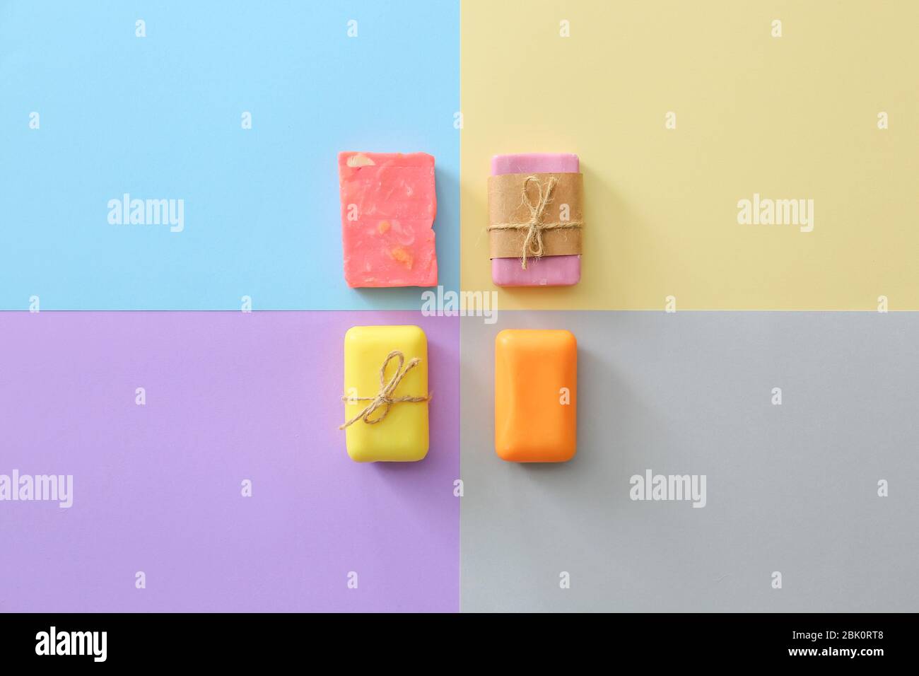 Different soap on color background Stock Photo - Alamy