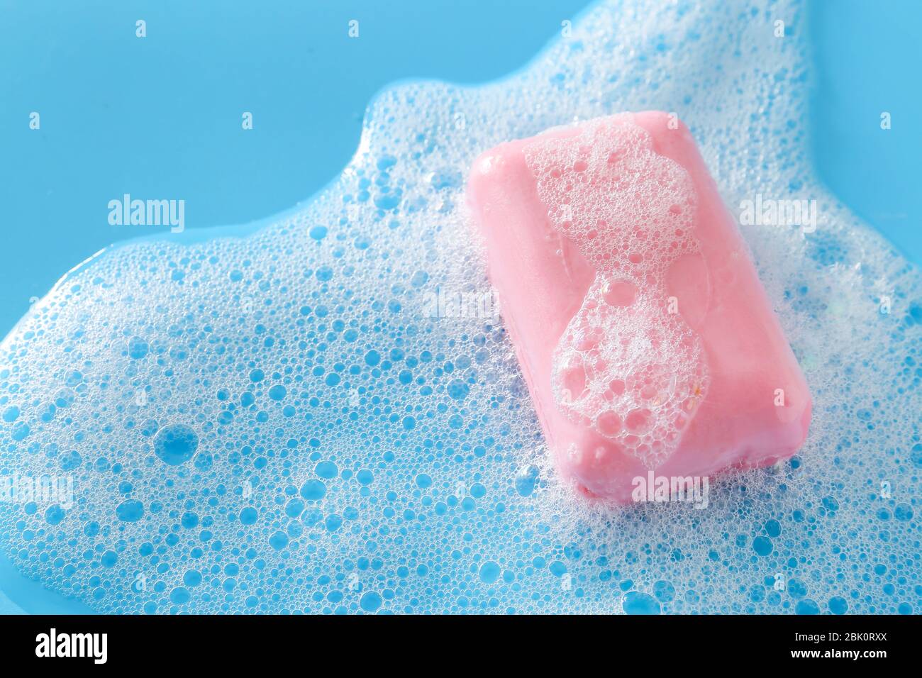 Soap bar on color background Stock Photo - Alamy