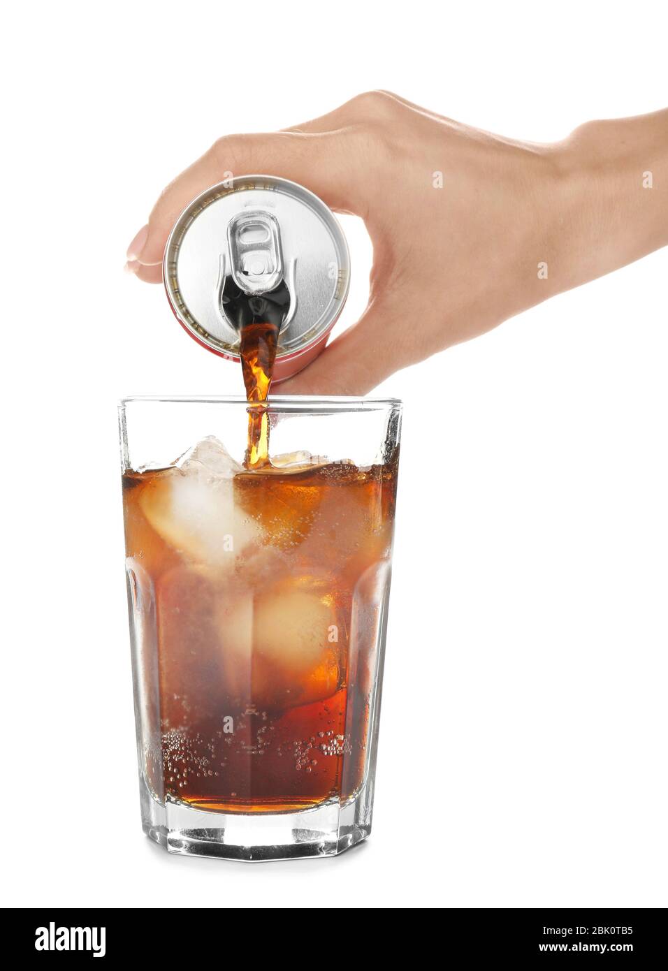 Woman pouring cola into glass on white background Stock Photo - Alamy