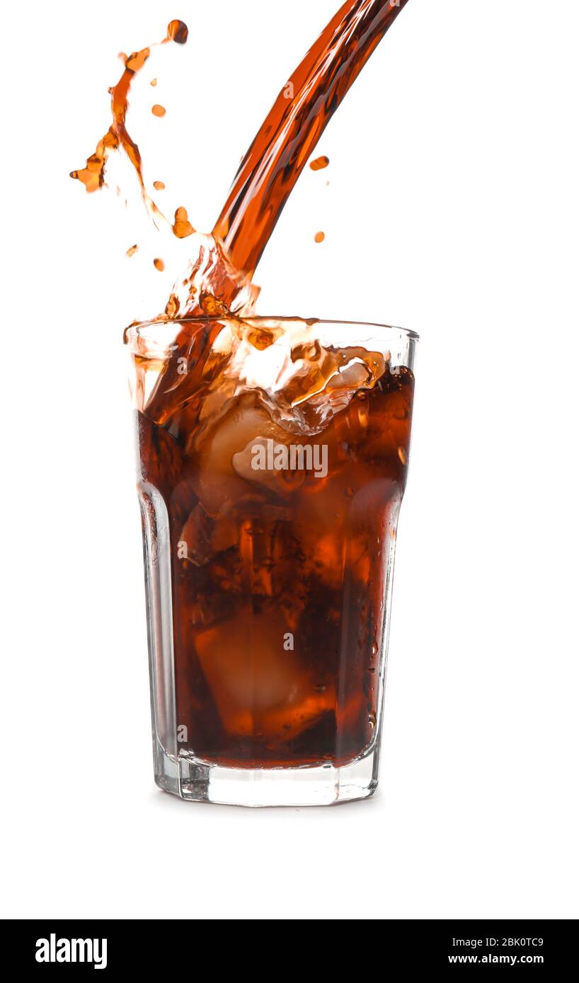 Pouring of cold cola into glass on white background Stock Photo - Alamy