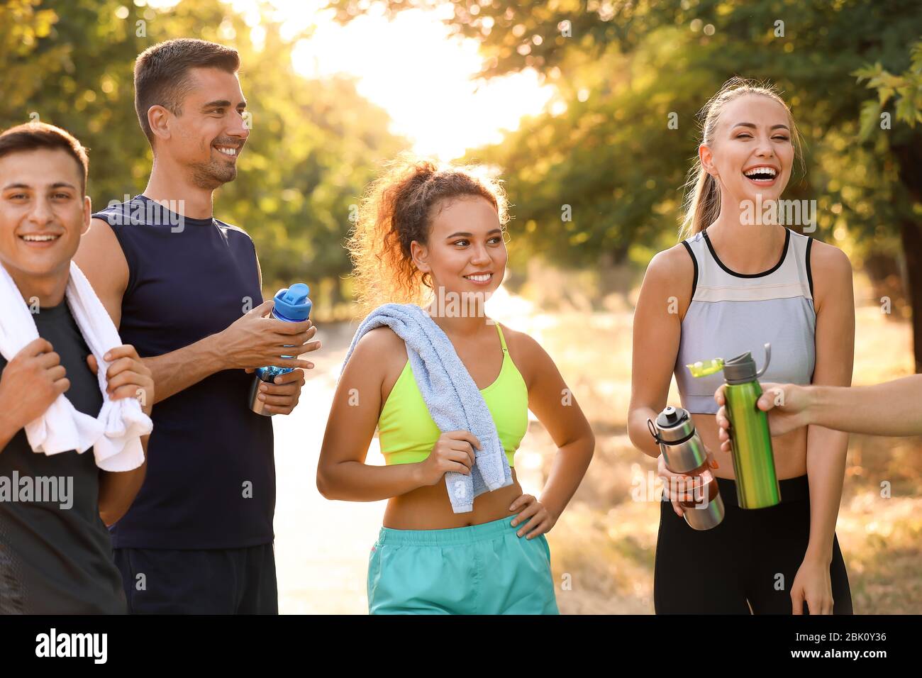 Group of sporty young people outdoors Stock Photo - Alamy