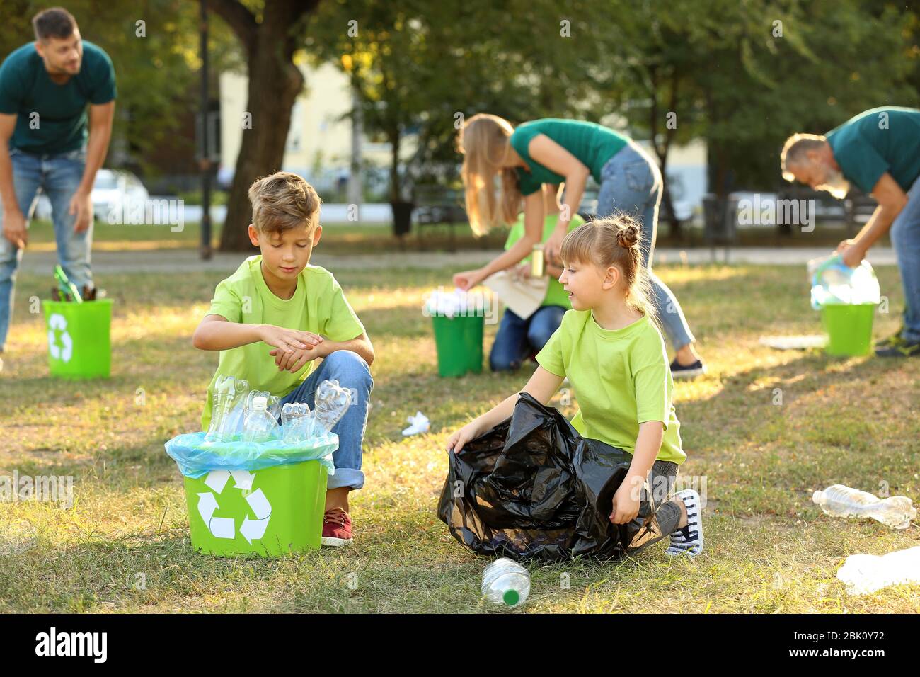 People gathering garbage outdoors. Concept of recycling Stock Photo - Alamy