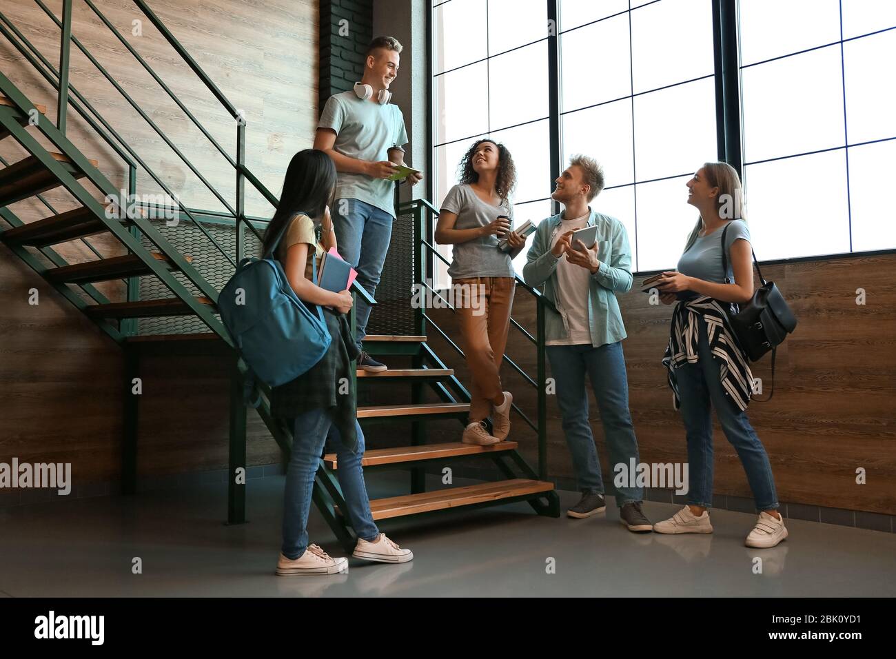 Group of students in university Stock Photo - Alamy