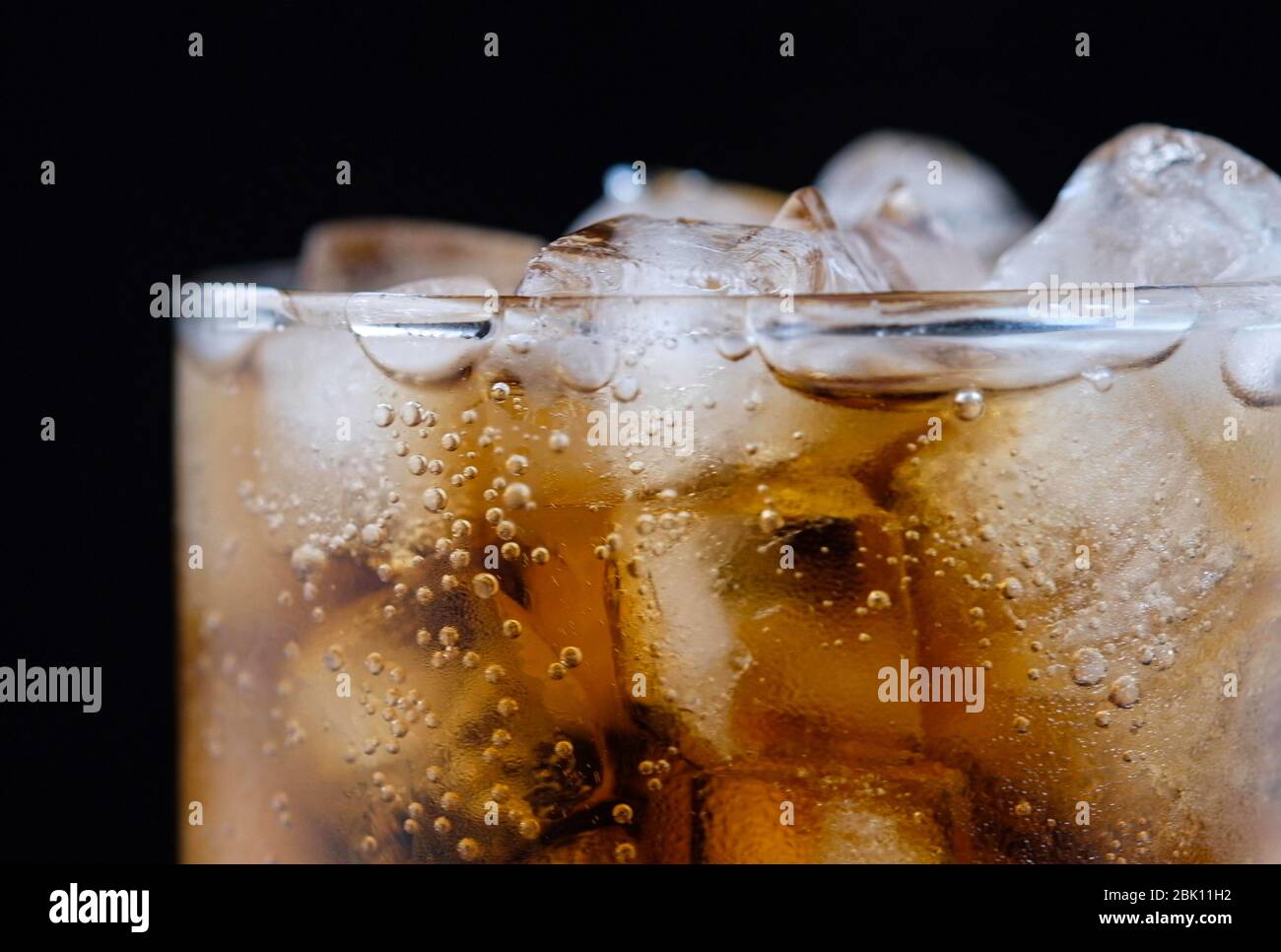 ice cube in fizzy splashing water with soda bubble Stock Photo - Alamy