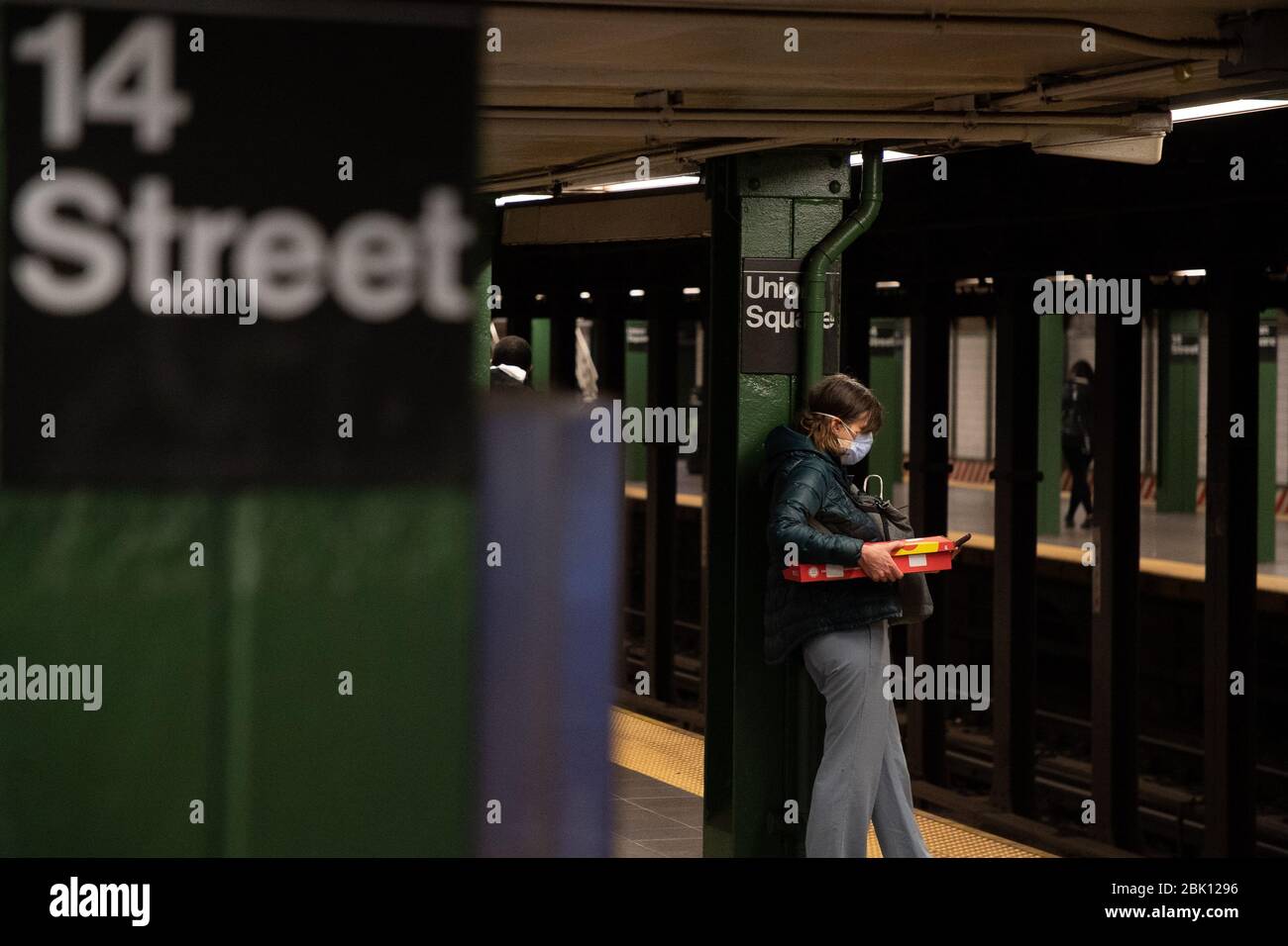 New York City, United States. 30th Apr, 2020. A subway commuter wearing ...