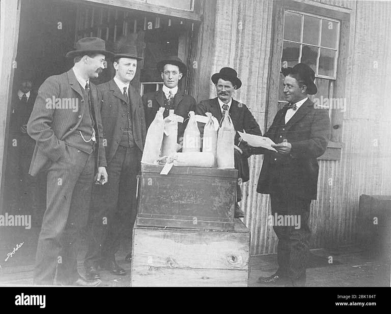 Hot Air Mine owners posing with bags of gold Nome Alaska between 1899 ...