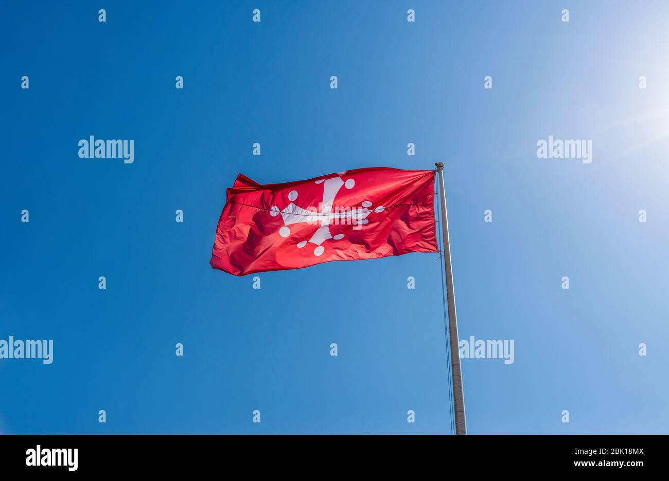 Pisan Cross, the official flag of Pisa province in Italy against blue ...