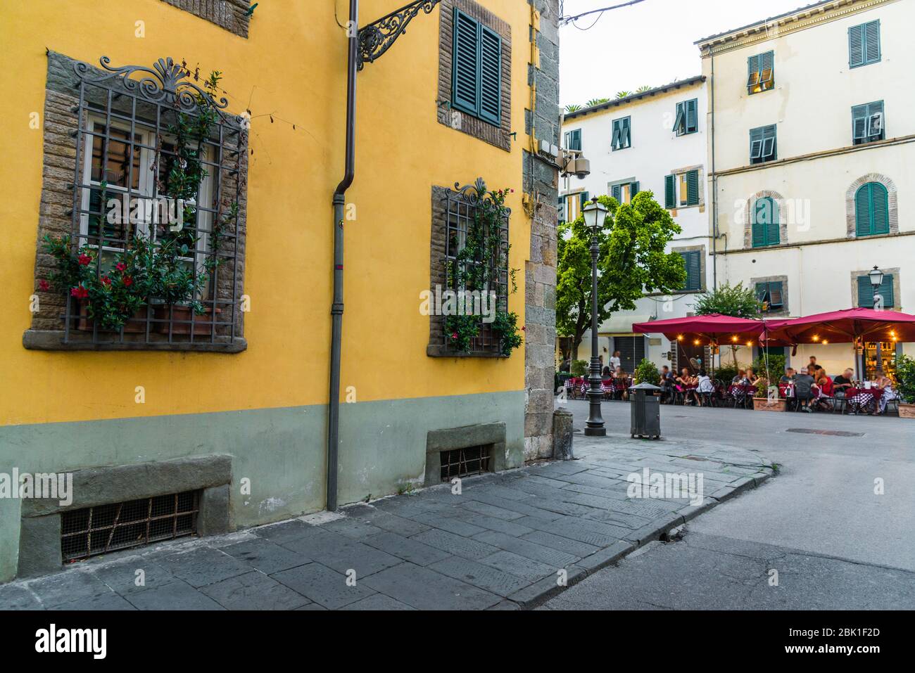 Narrow streets of Lucca ancient town with traditional architecture ...