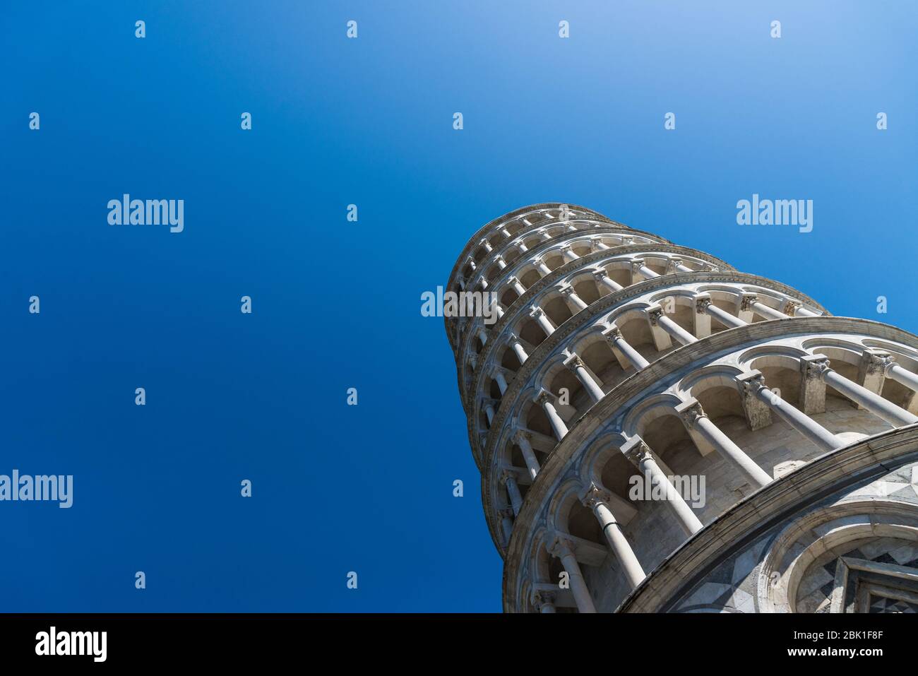 The Leaning Tower of Pisa against the background of blue sunny sky ...
