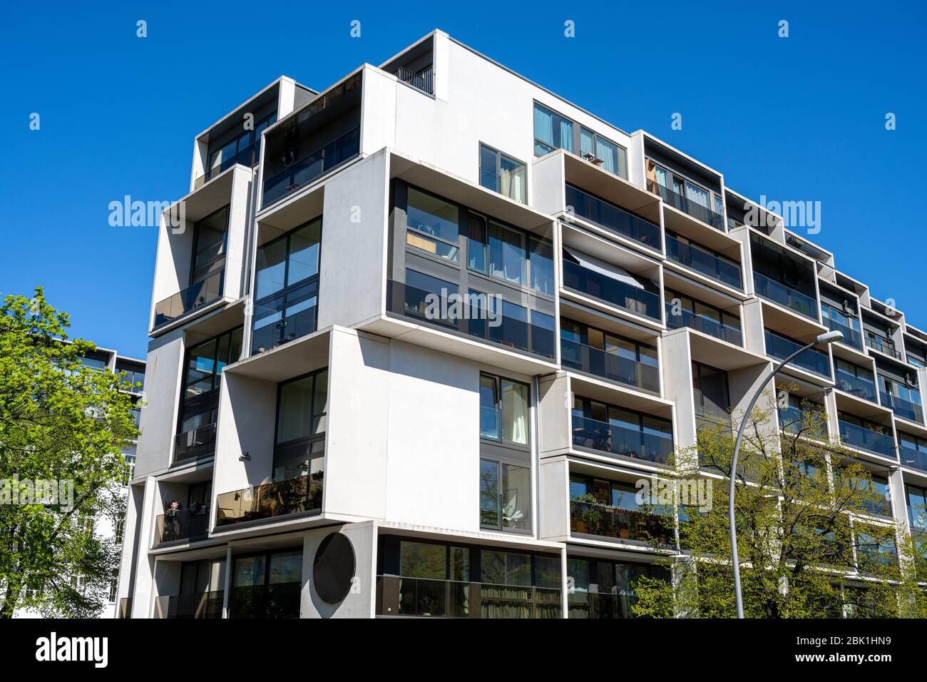 Modern apartment building with floor-to-ceiling windows seen in Berlin ...