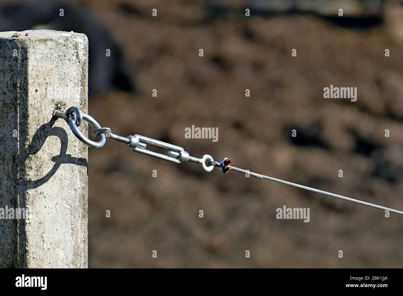 Tension hook with wire rope, stretched on a concrete bar Stock Photo ...