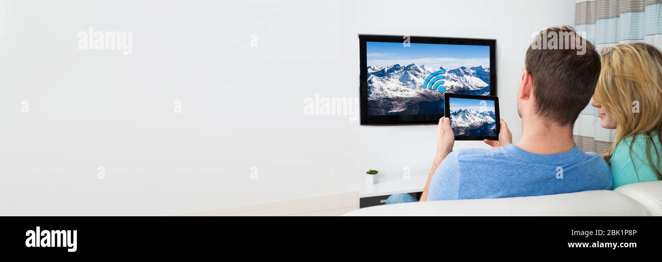 Tablet Connected To TV. People Watching And Streaming Stock Photo - Alamy