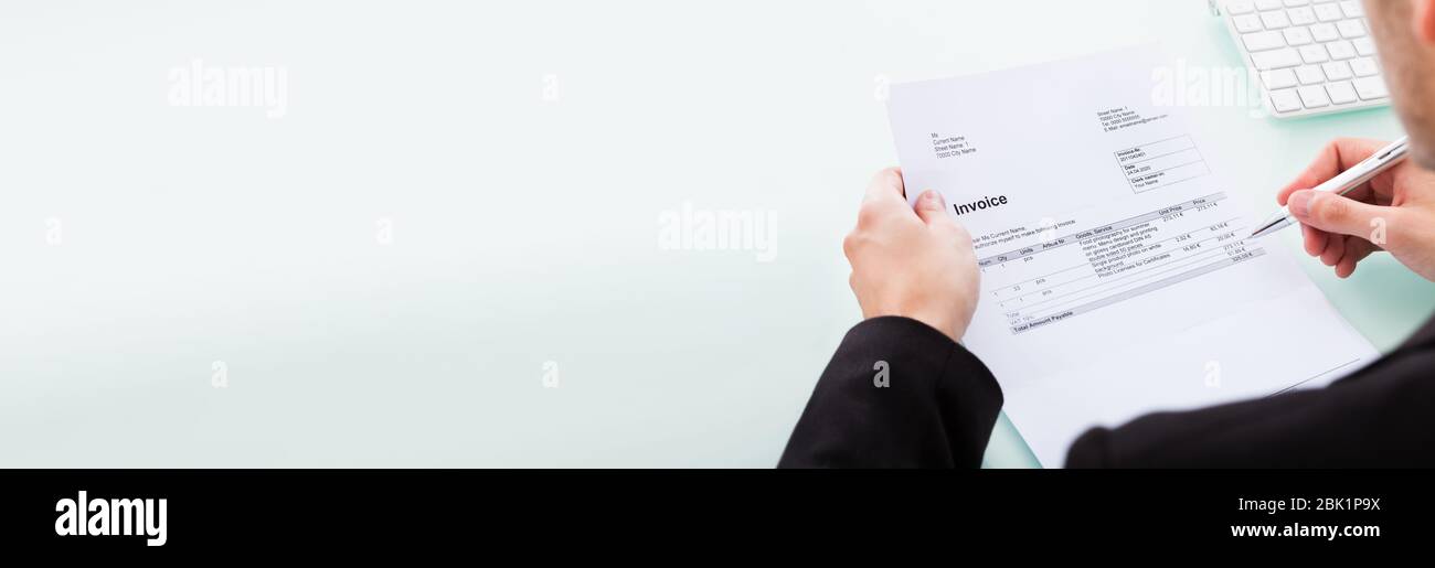 Person Filling Invoice At Desk Bill Management Stock Photo - Alamy